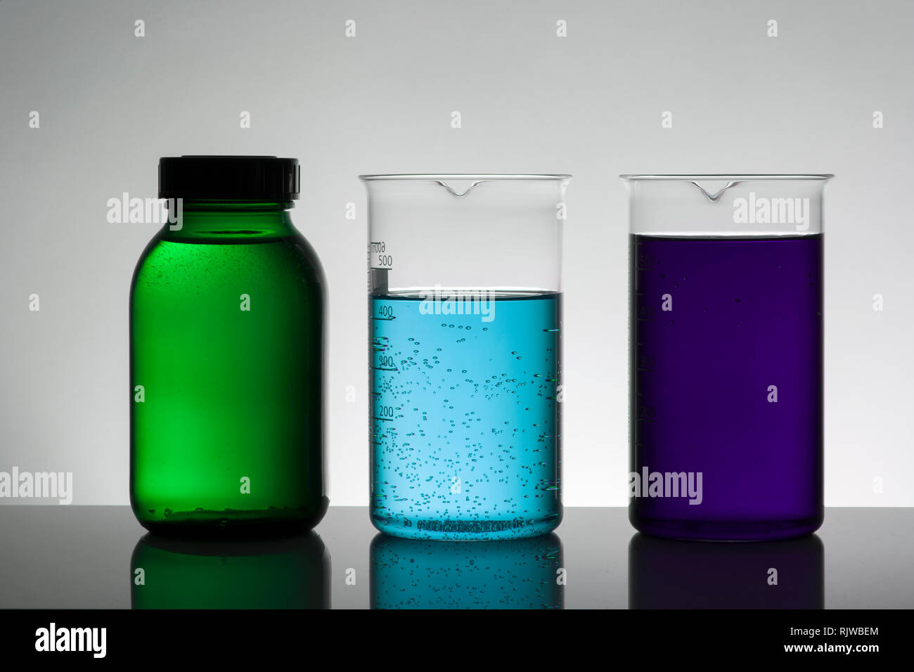 Liquid in laboratory bottles. Scientific biochemical laboratory ...