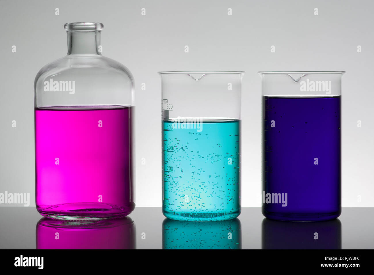 Liquid in laboratory bottles. Scientific biochemical laboratory ...