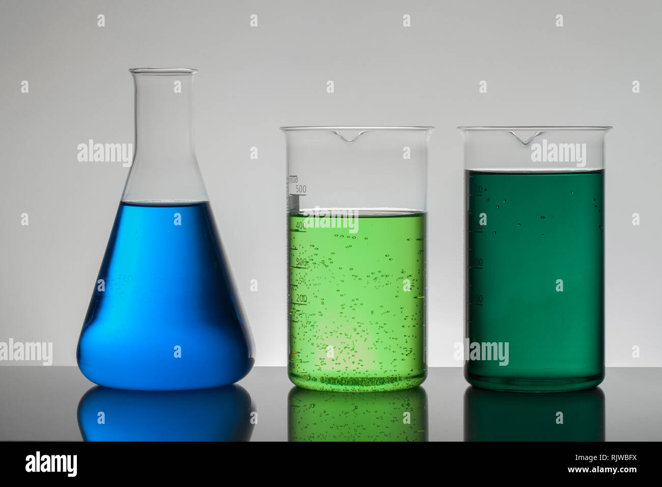 Liquid in laboratory bottles. Scientific biochemical laboratory ...