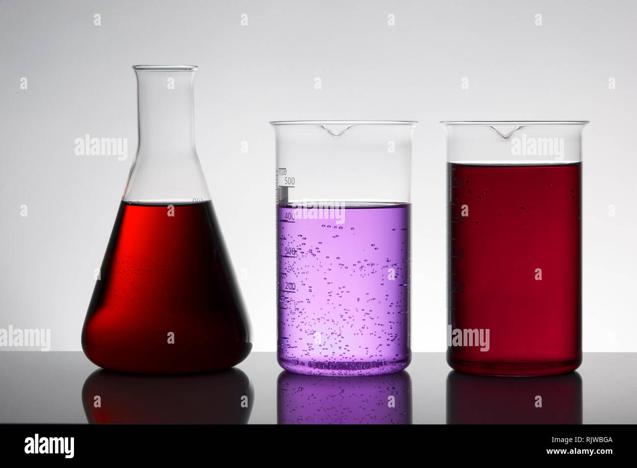 Liquid in laboratory bottles. Scientific biochemical laboratory ...