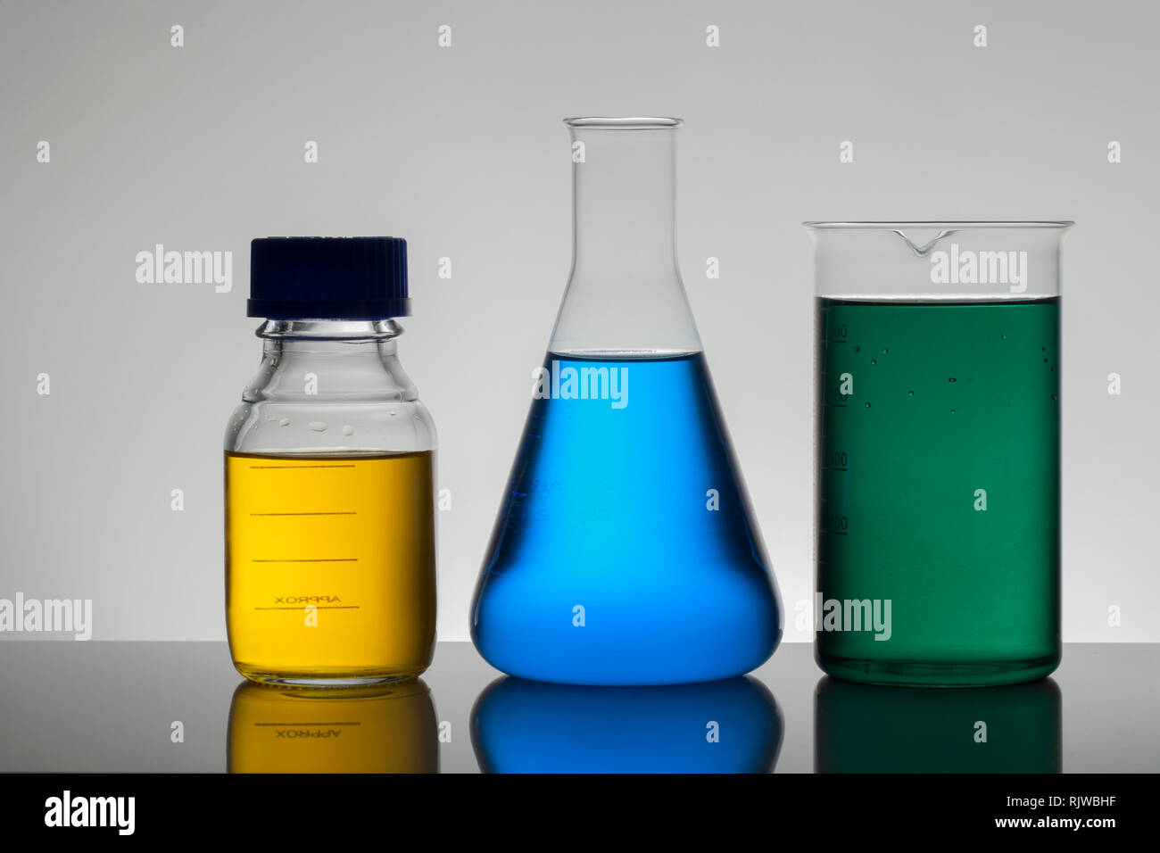 Liquid in laboratory bottles. Scientific biochemical laboratory ...