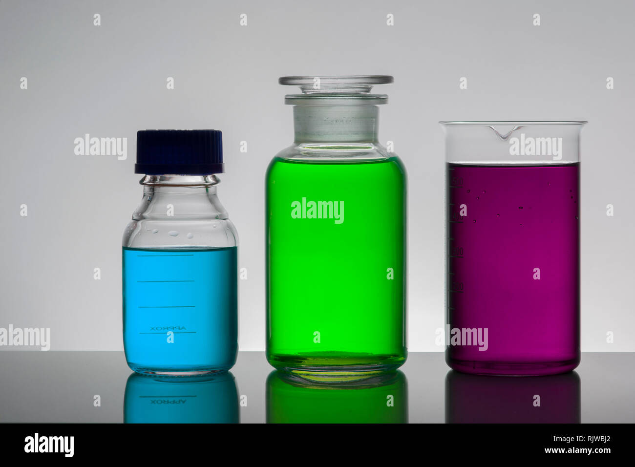 Liquid in laboratory bottles. Scientific biochemical laboratory ...