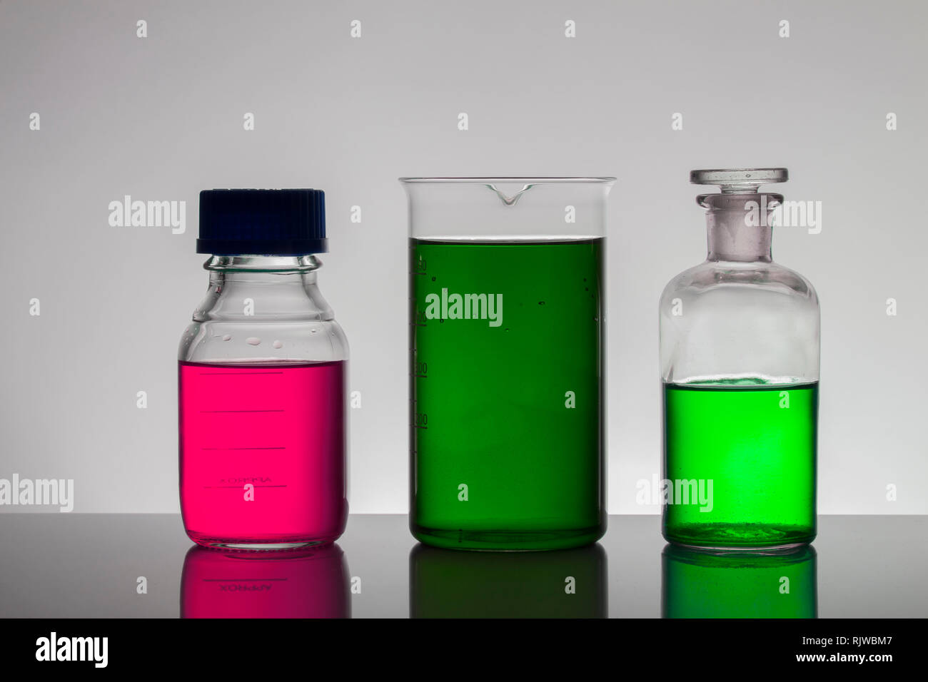 Liquid in laboratory bottles. Scientific biochemical laboratory ...