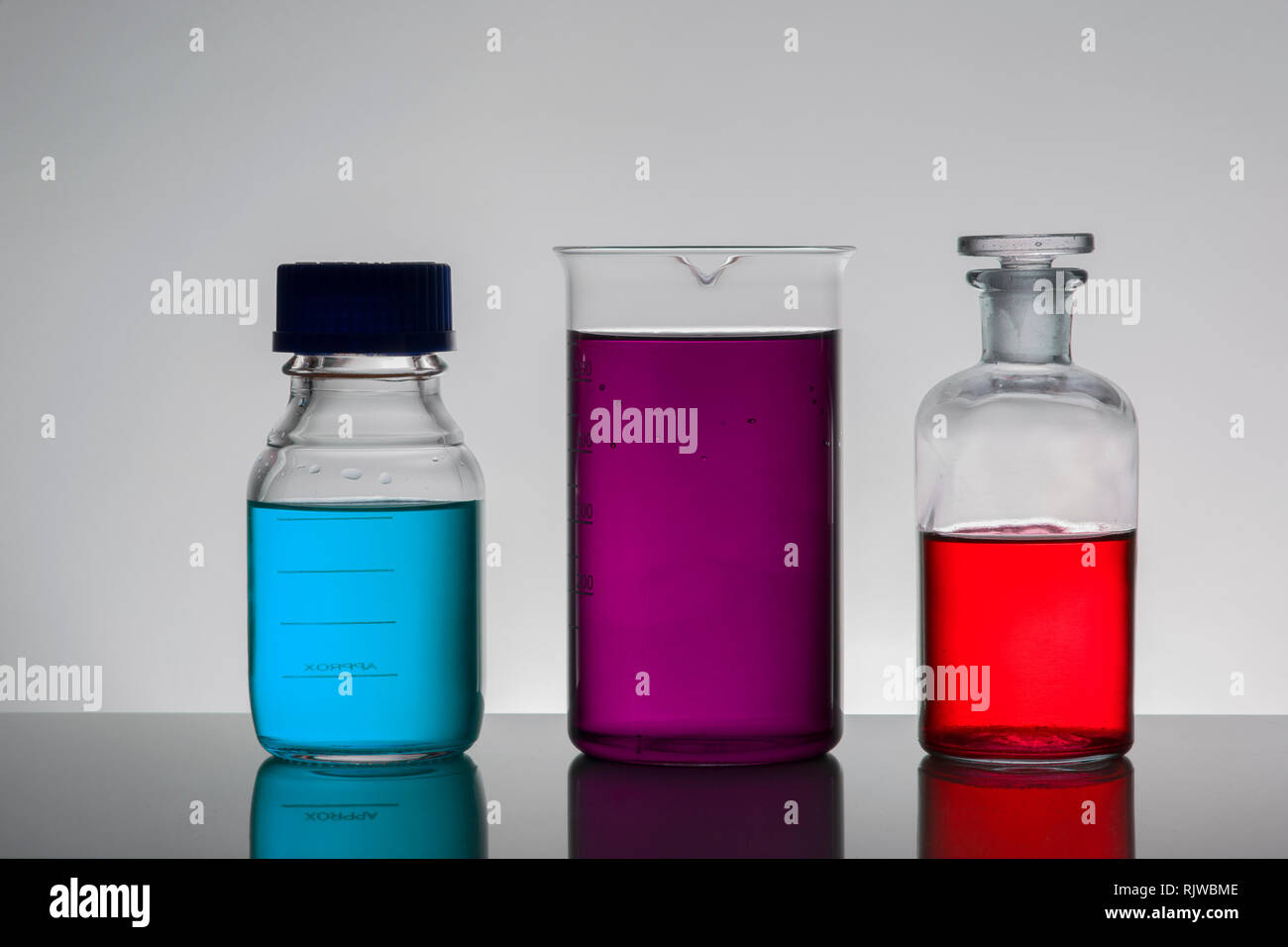 Liquid in laboratory bottles. Scientific biochemical laboratory ...