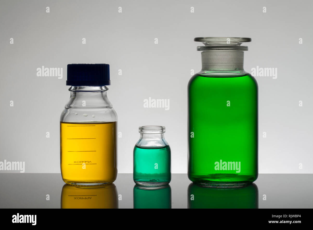 Liquid in laboratory bottles. Scientific biochemical laboratory ...