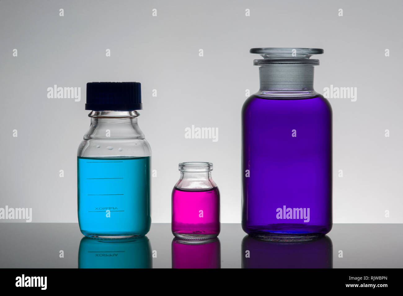 Liquid in laboratory bottles. Scientific biochemical laboratory ...