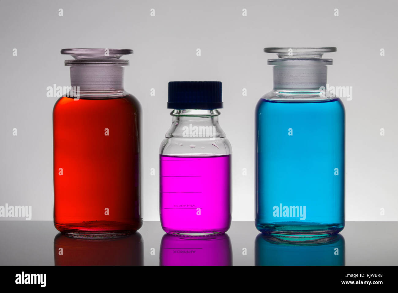 Liquid in laboratory bottles. Scientific biochemical laboratory ...