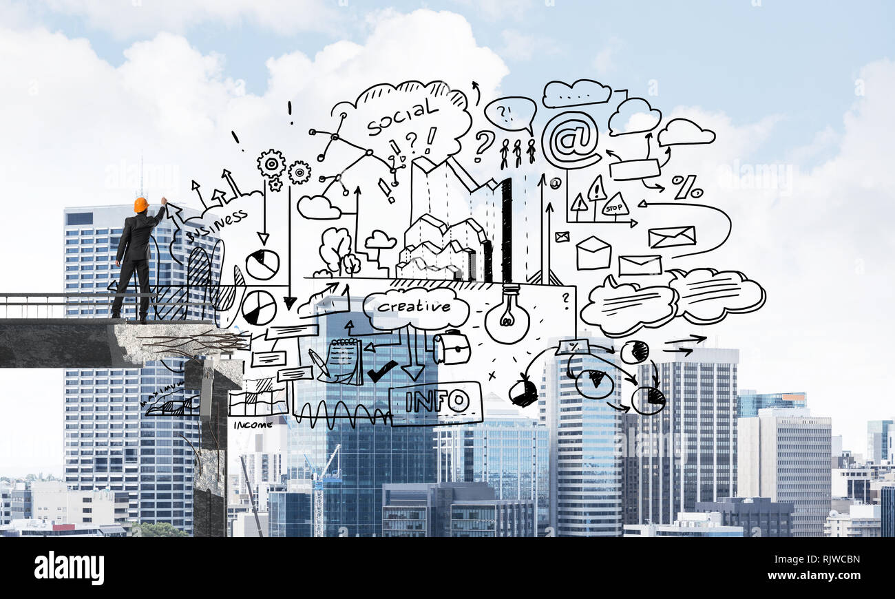 Businessman drawing business conceptual sketches Stock Photo - Alamy