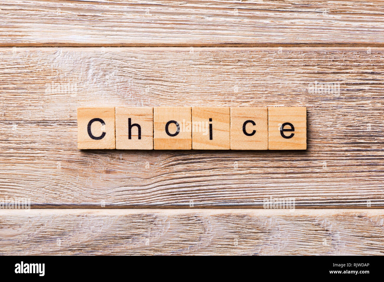 CHOICE word written on wood block. CHOICE text on wooden table for your ...