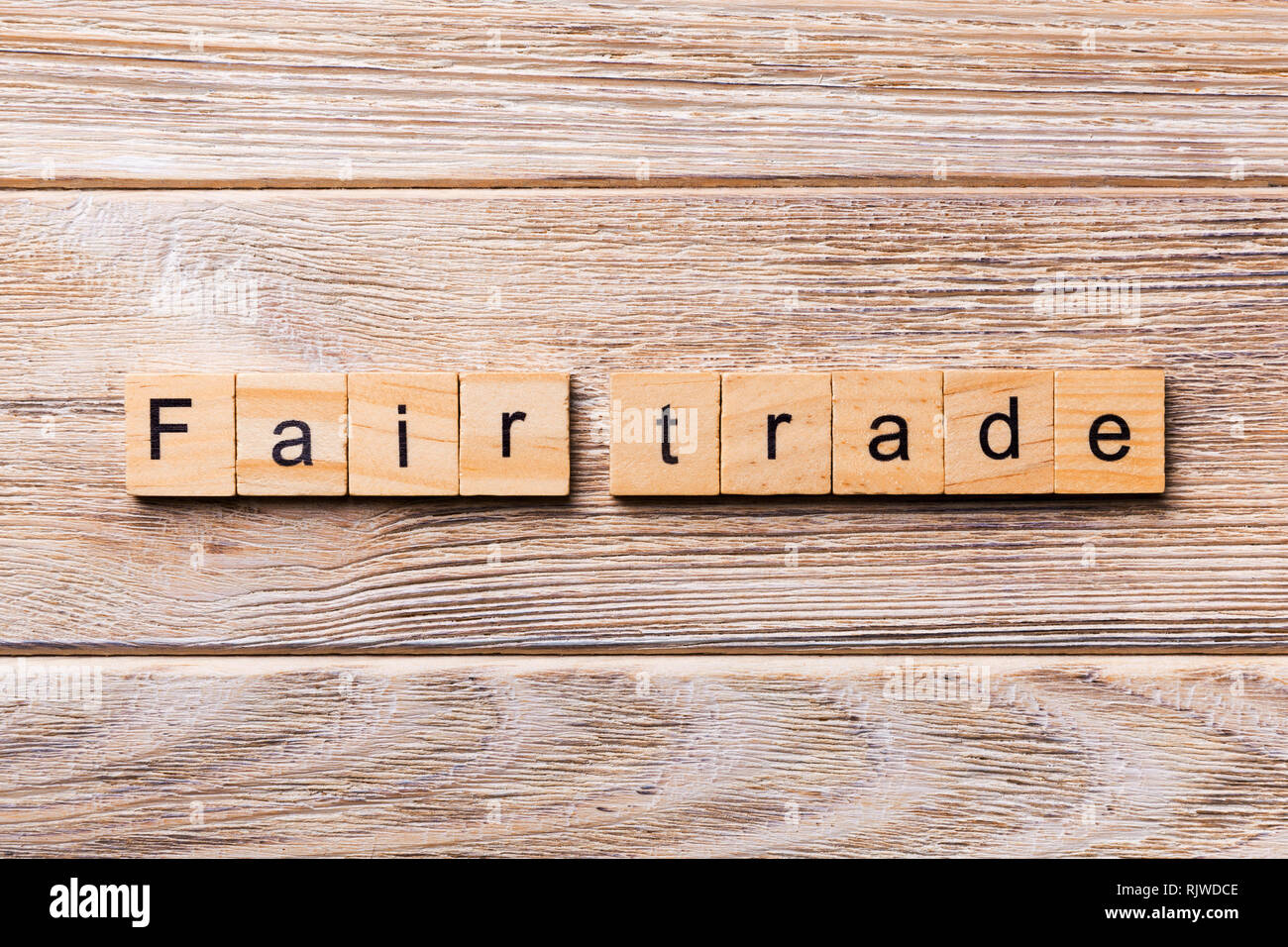 fair trade word written on wood block. fair trade text on wooden table ...