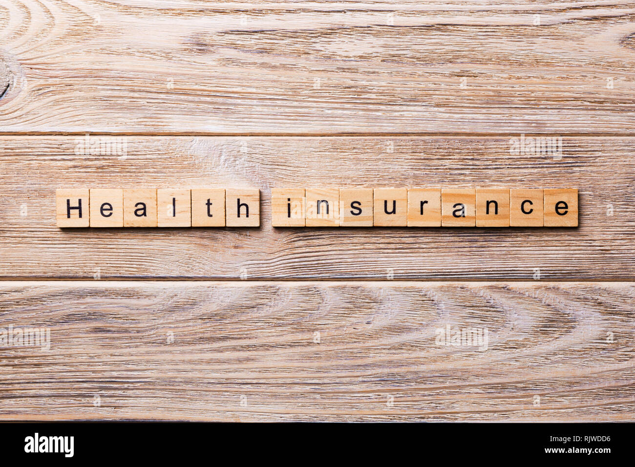 Health insurance word written on wood block. Health insurance text on ...