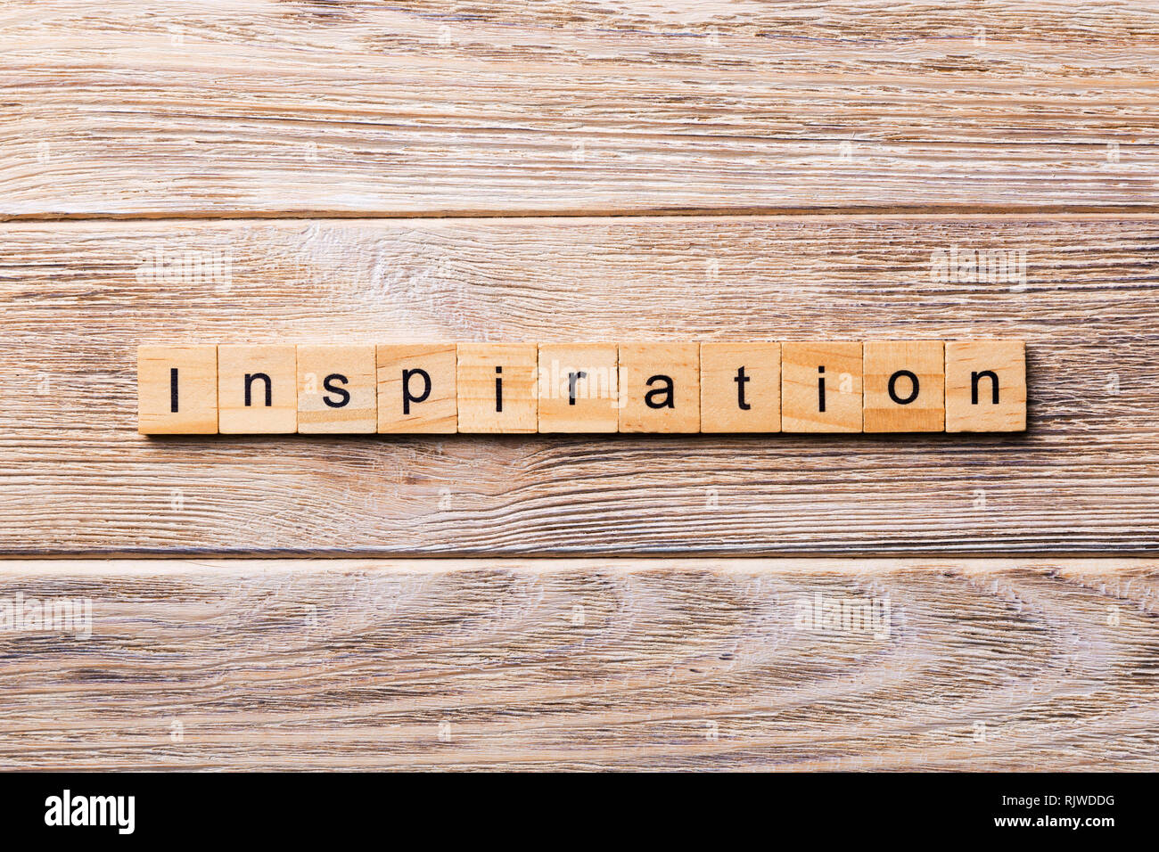 Inspiration word written on wood block. Inspiration text on wooden ...