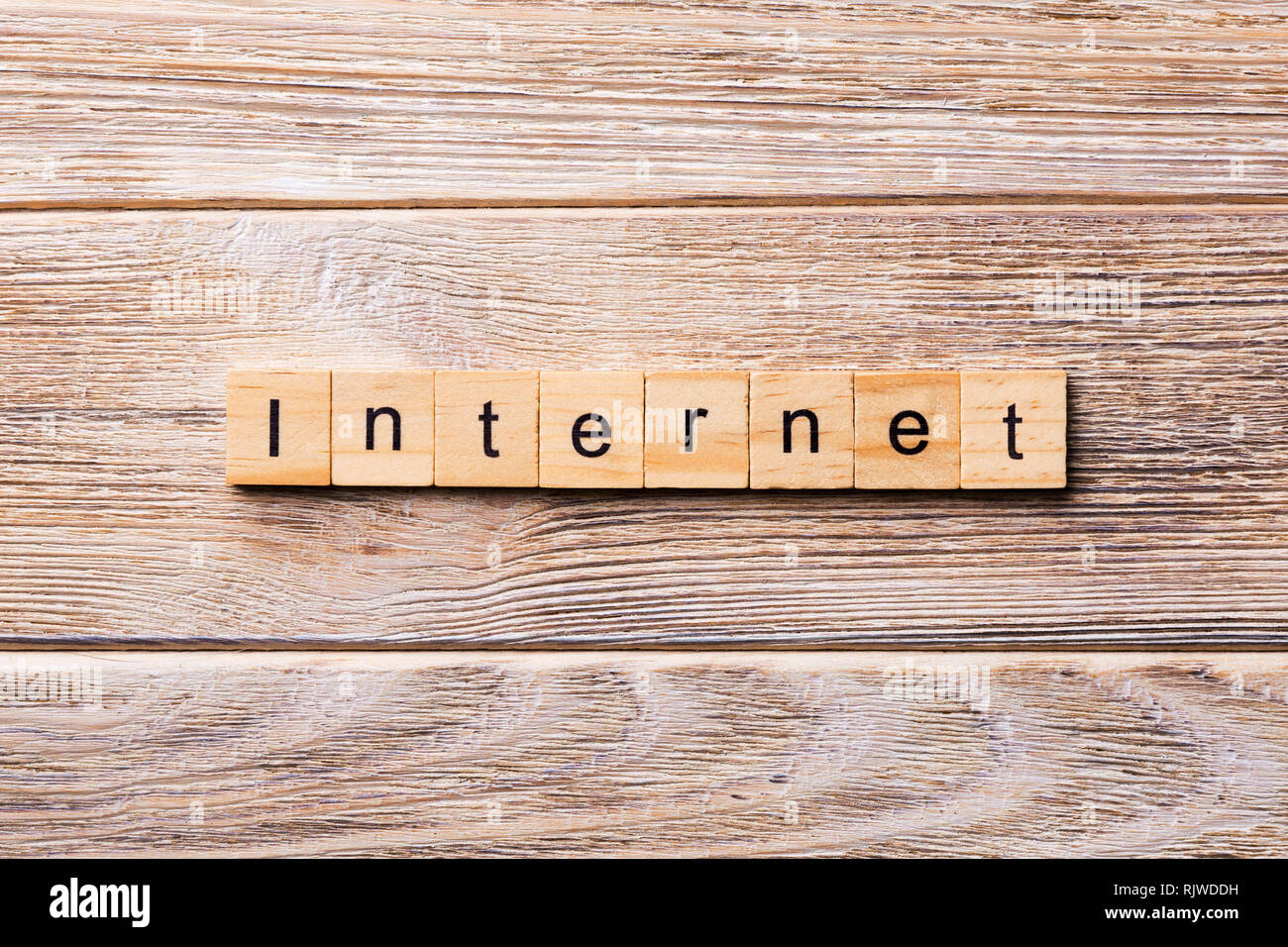 INTERNET word written on wood block. INTERNET text on wooden table for ...