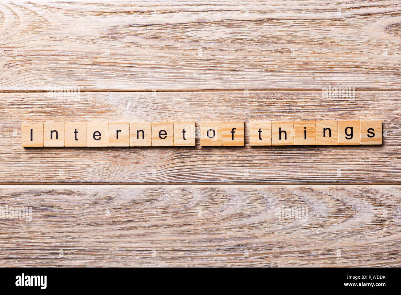 internet of things word written on wood block. IoT text on wooden table ...