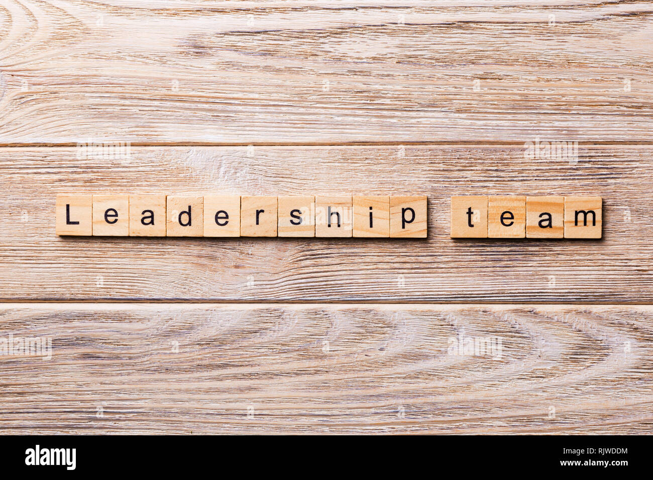 leadership team word written on wood block. leadership team text on ...