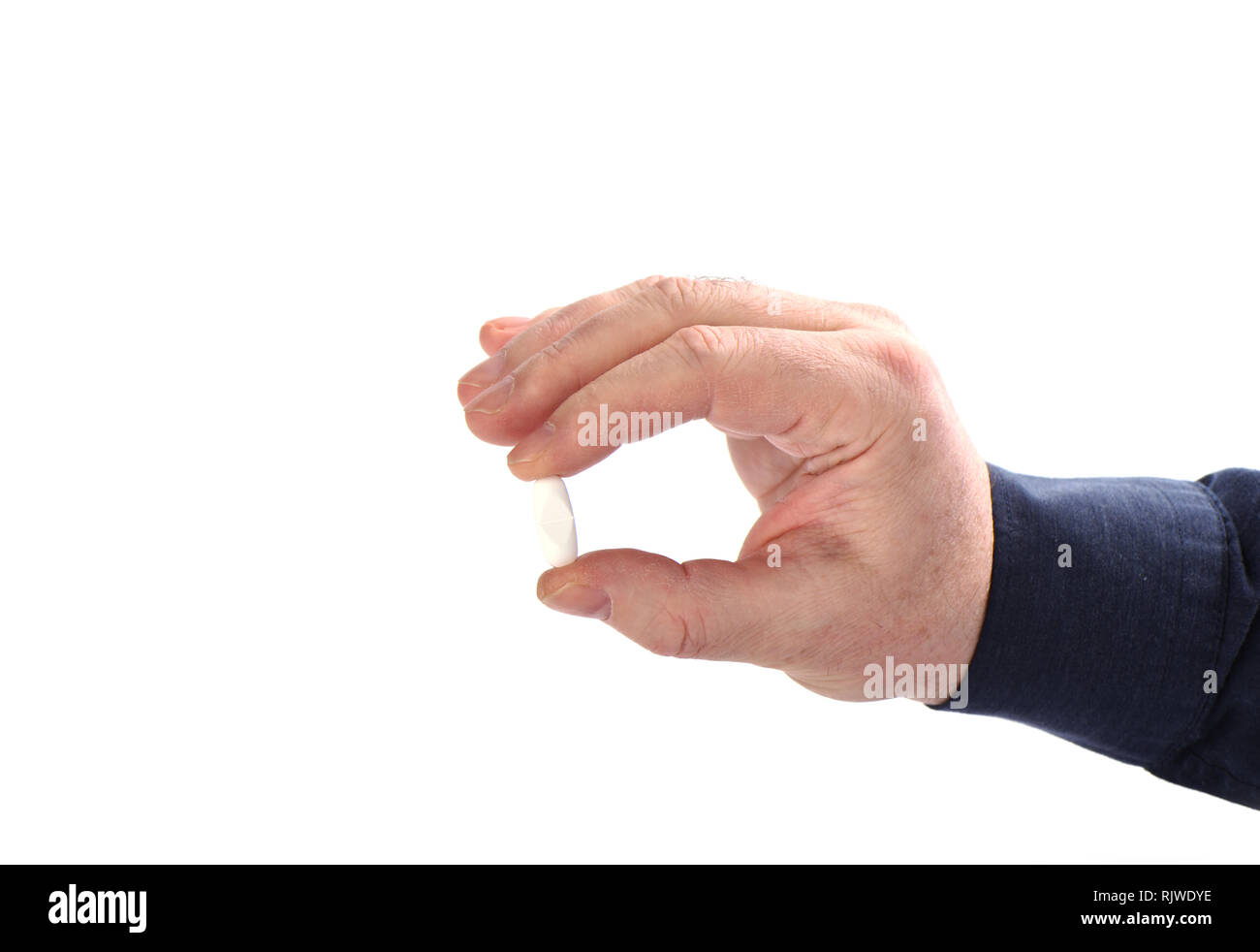 Medication pill in male hand isolated on white background Stock Photo ...