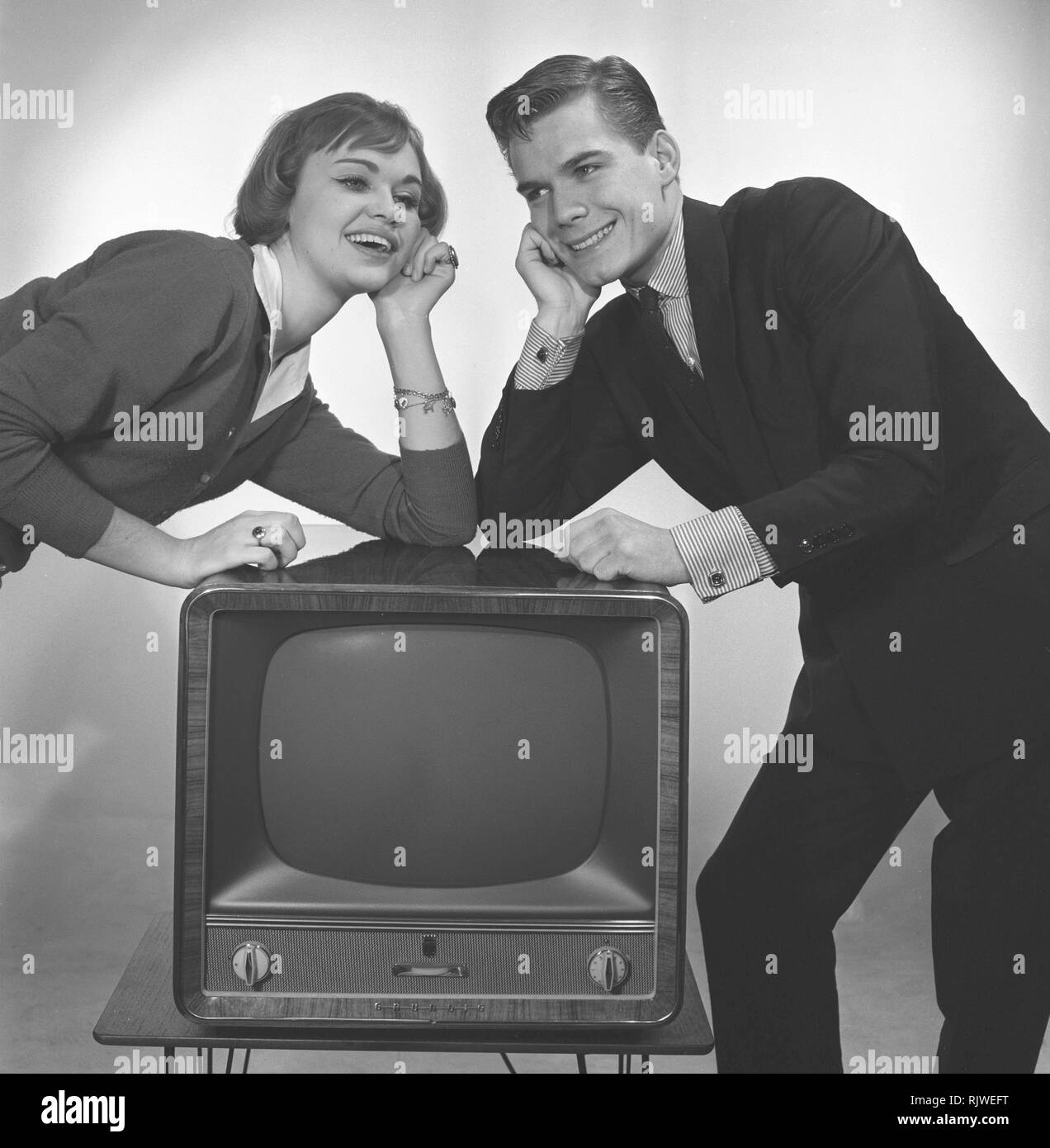 Television in the 1950s. A young couple is pictured beside a typical ...