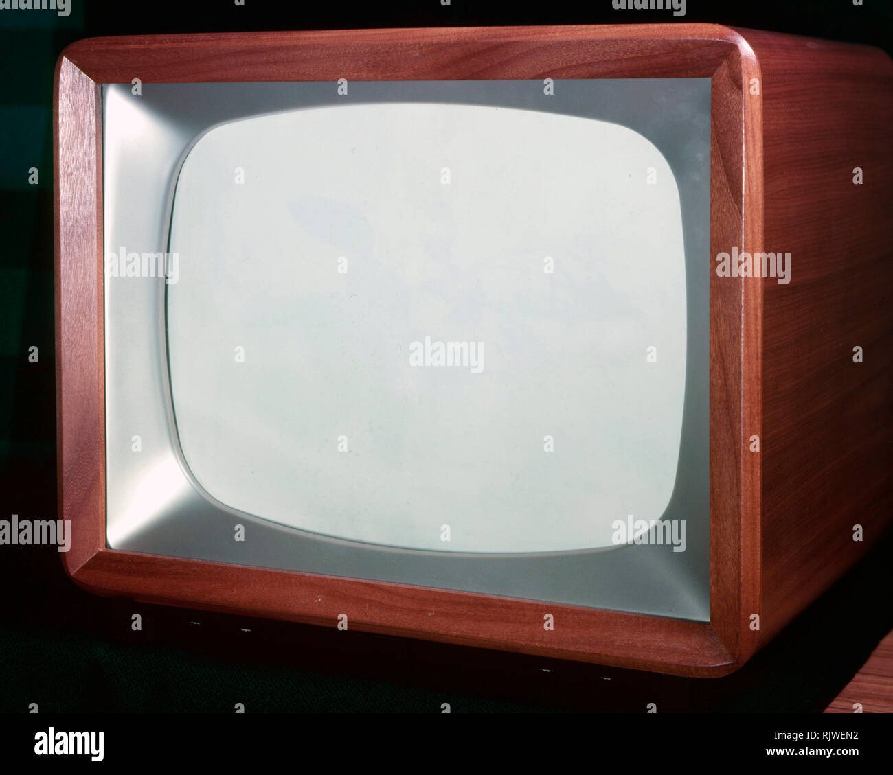 Television in the 1950s. A typical tv furniture in a wooden casing with ...