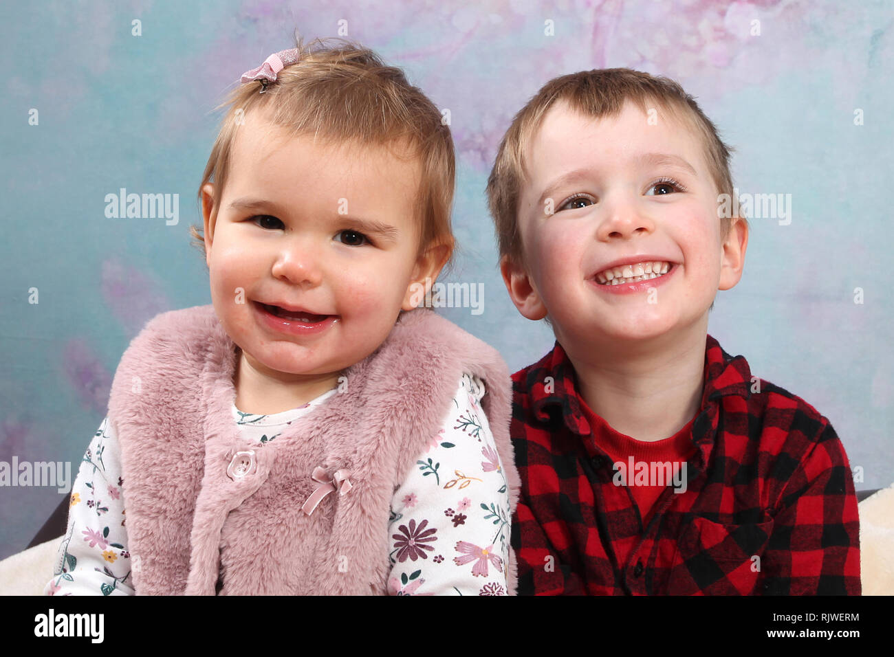 Brother sister cuddling hi-res stock photography and images - Alamy