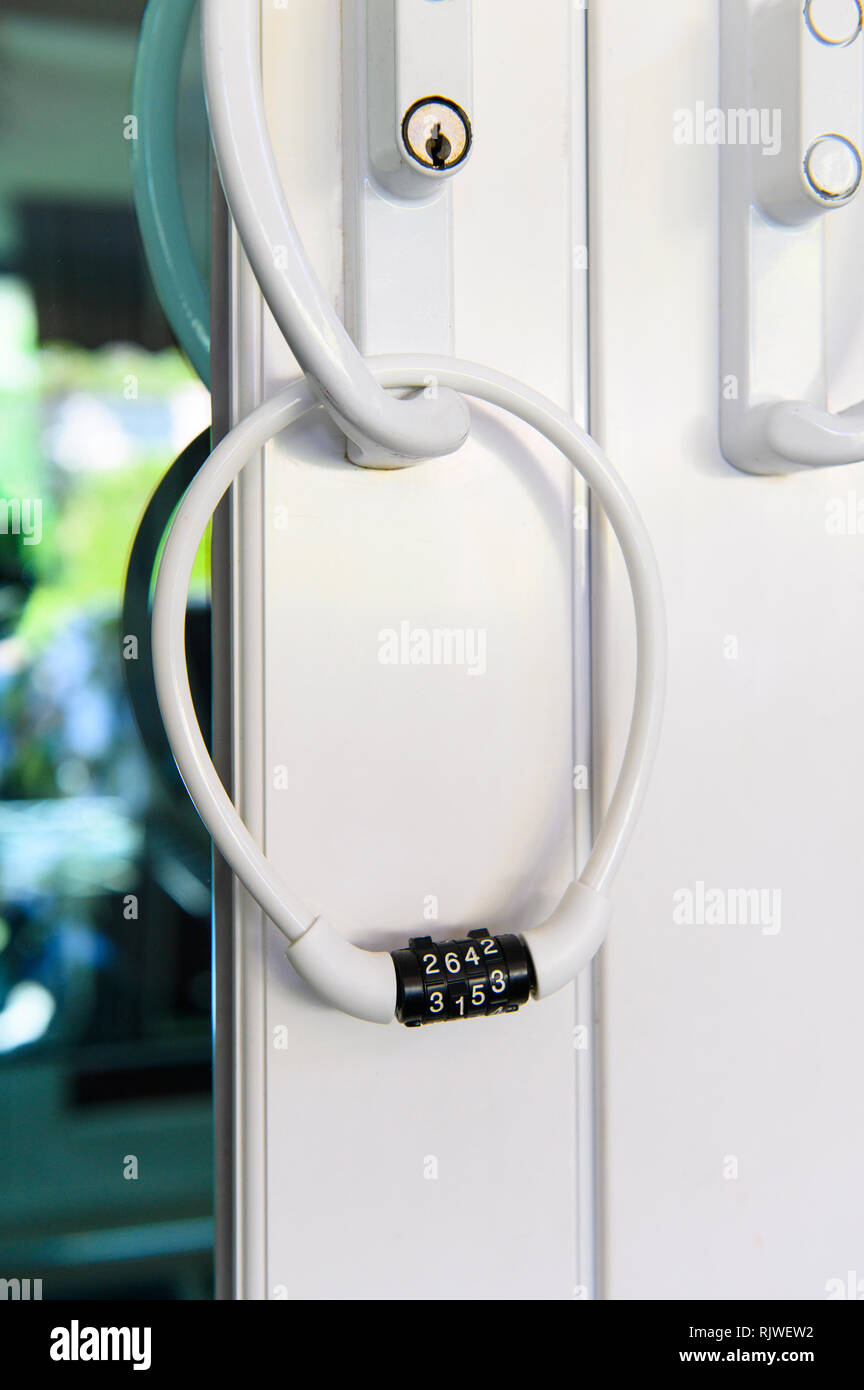 Door locked with number combination padlock Stock Photo - Alamy
