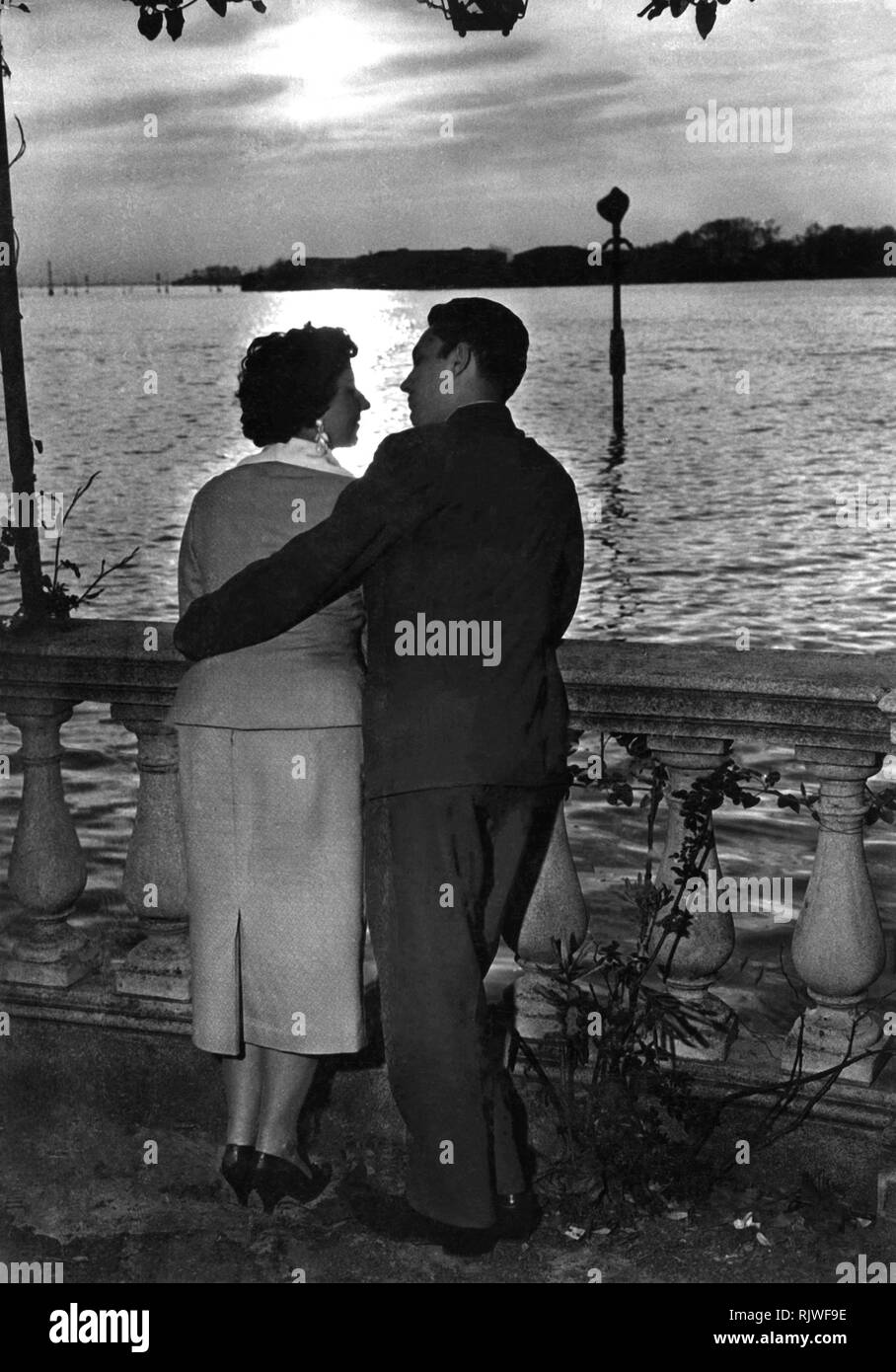 Couple in love at sunset by the sea, 1930s, Portugal Stock Photo - Alamy