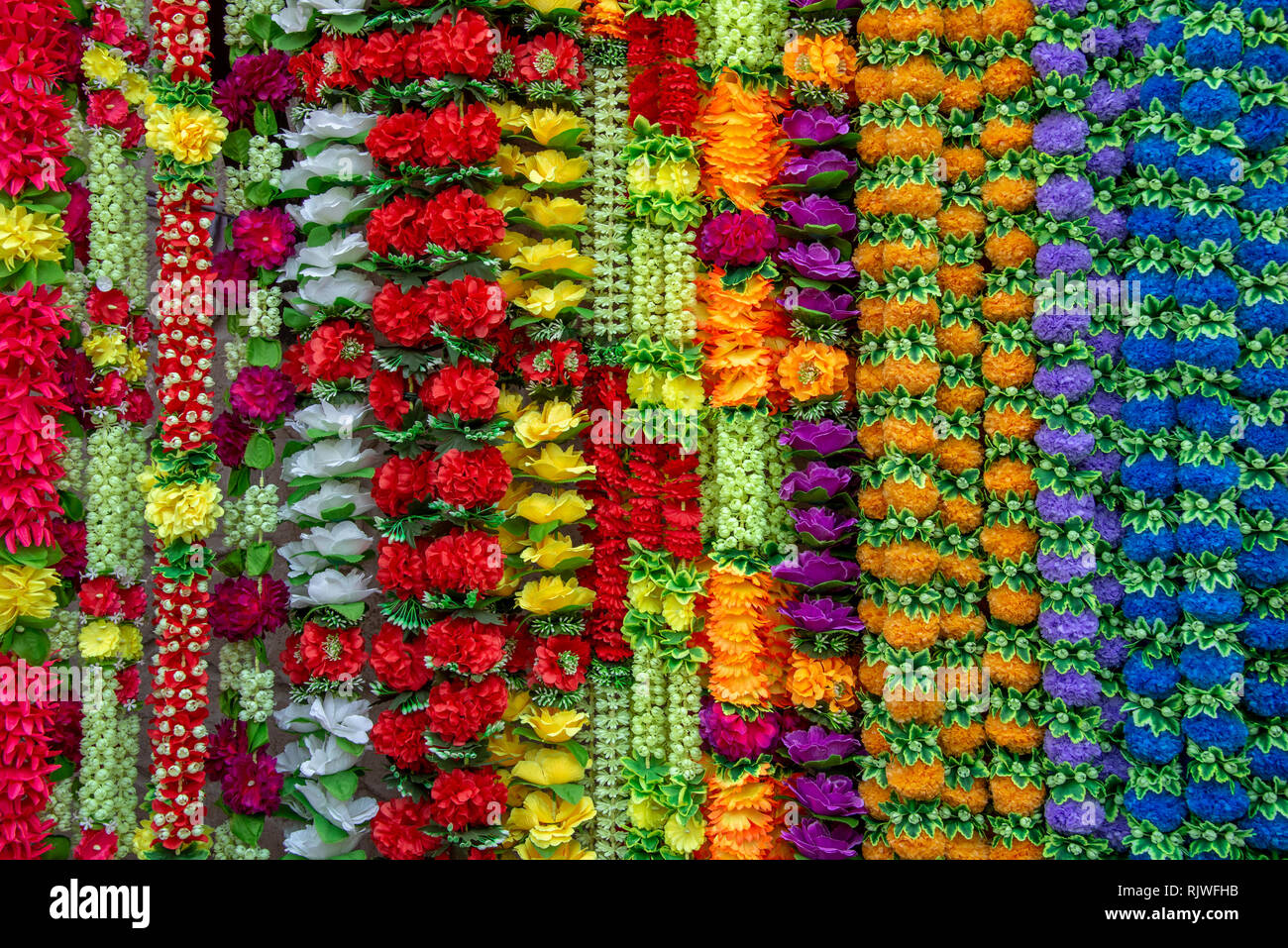 Colorful flower garlands background Stock Photo - Alamy