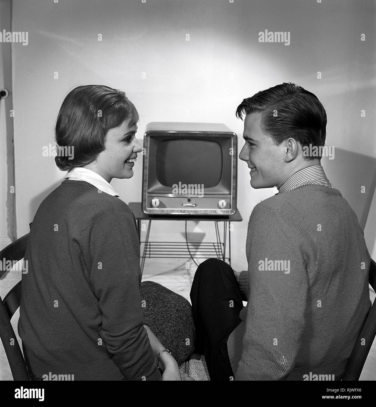 Television in the 1950s. A young couple is pictured in front of a ...