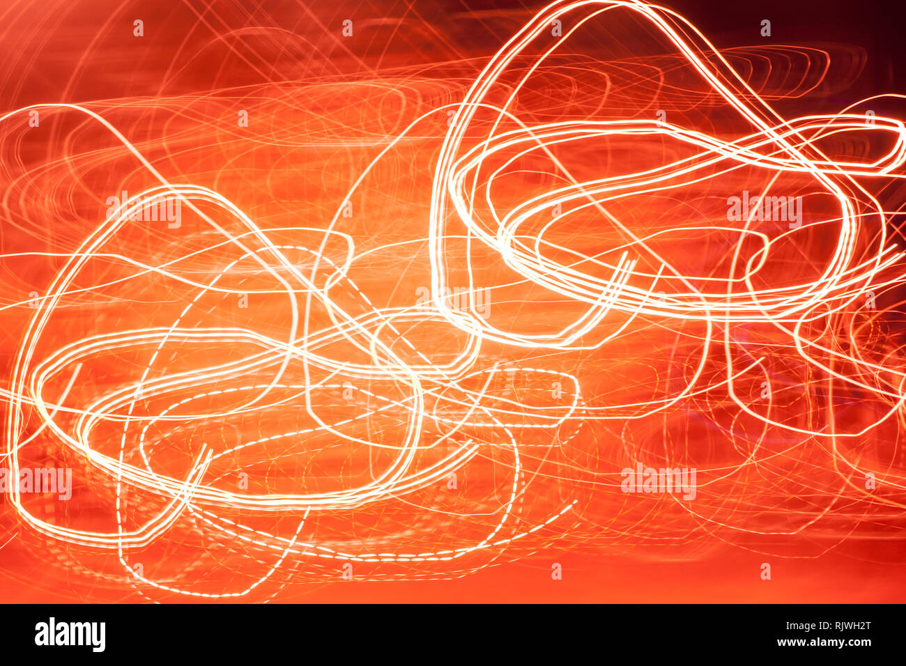 Abstract blurred red light effect on a black background. Long exposure ...