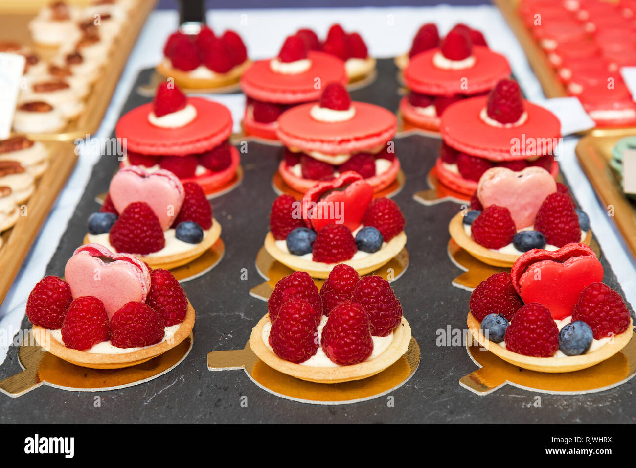 Raspberry tart cakes, tasty sweet desserts, baked dough baskets, cheese ...