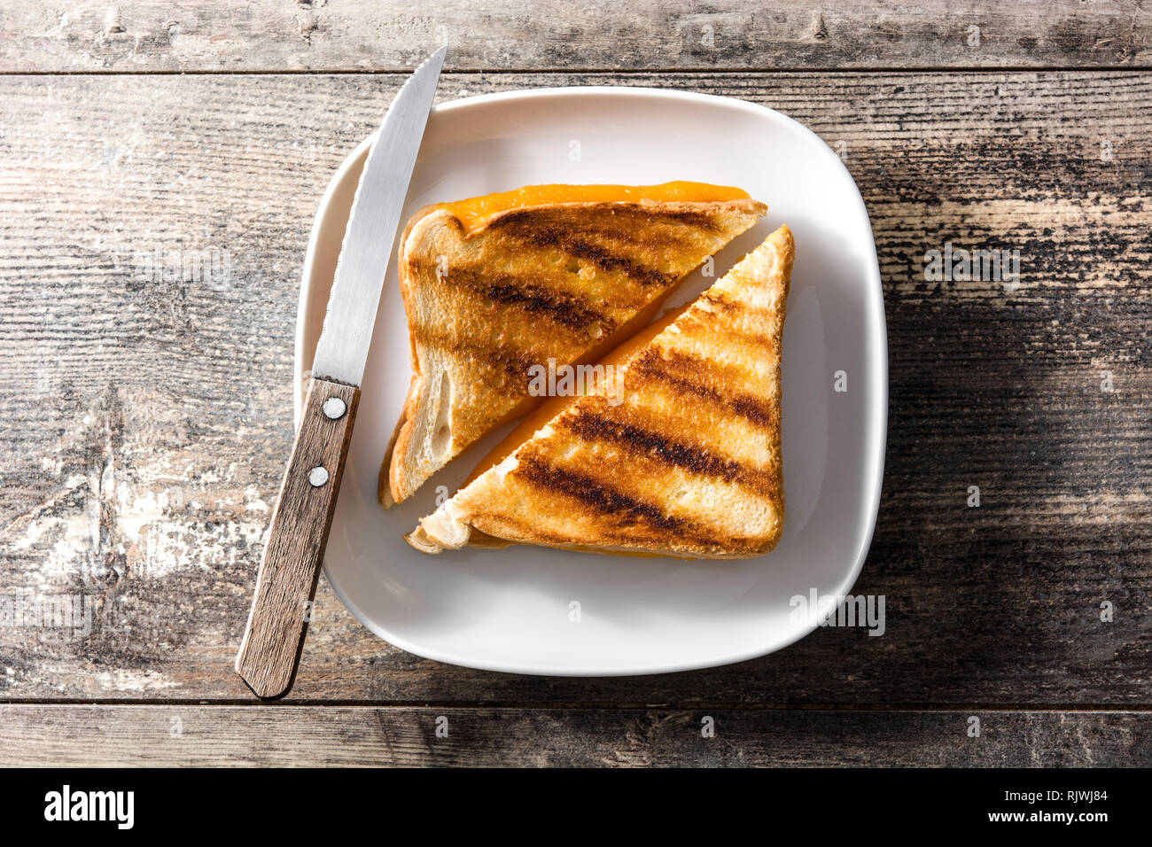 Grilled cheese sandwich on wooden table. Top view Stock Photo - Alamy