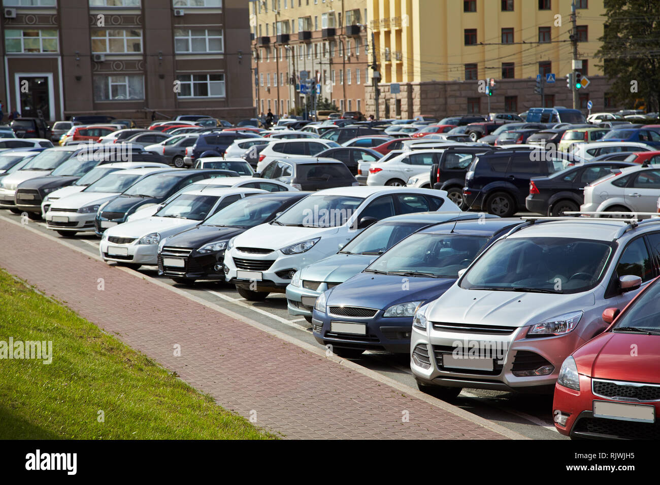 car park in the city center. a lot of cars on an area Stock Photo - Alamy