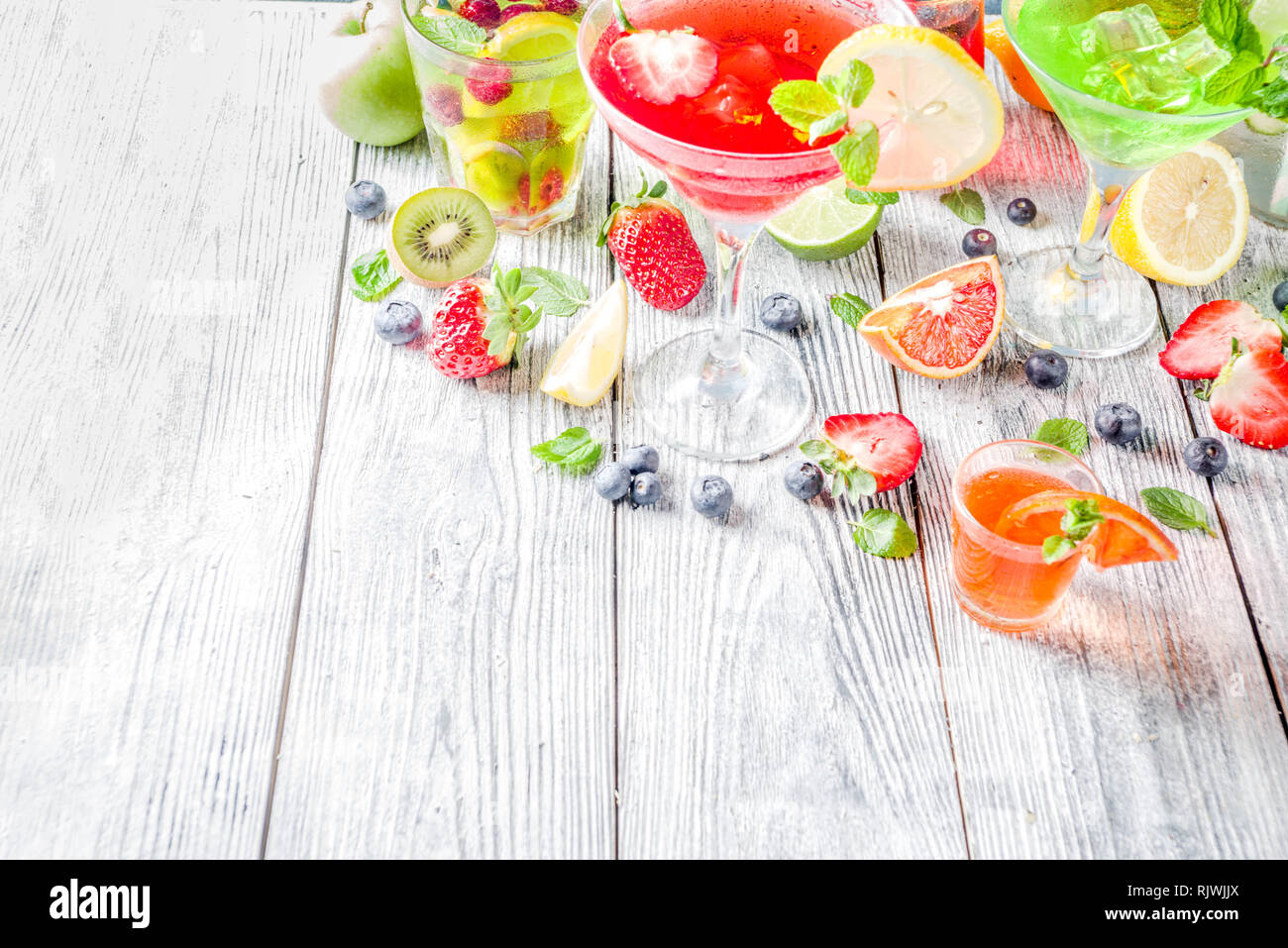 Selection summer fruit and berry cocktail drinks. wooden background ...