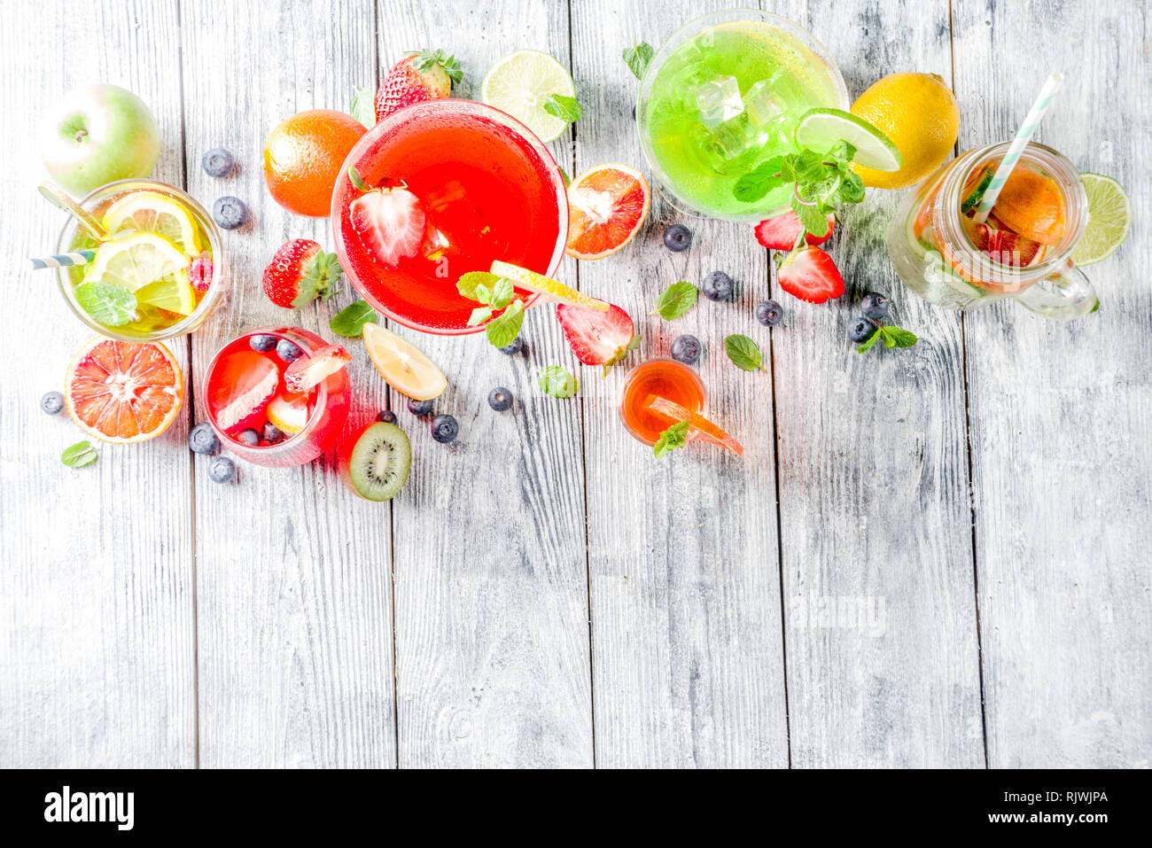 Selection summer fruit and berry cocktail drinks. wooden background ...