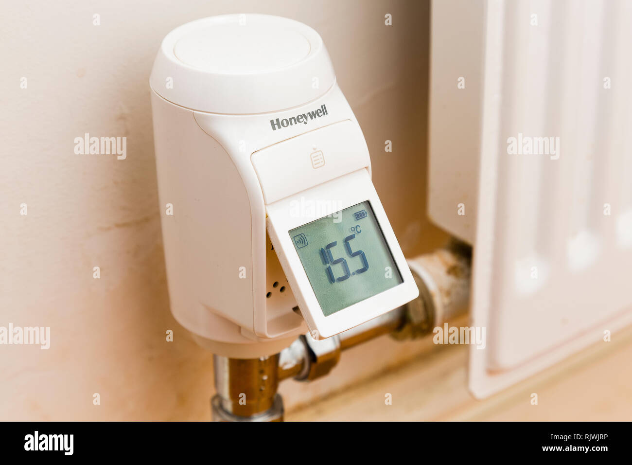 A smart wireless radiator valve attached to a domestic radiator Stock ...