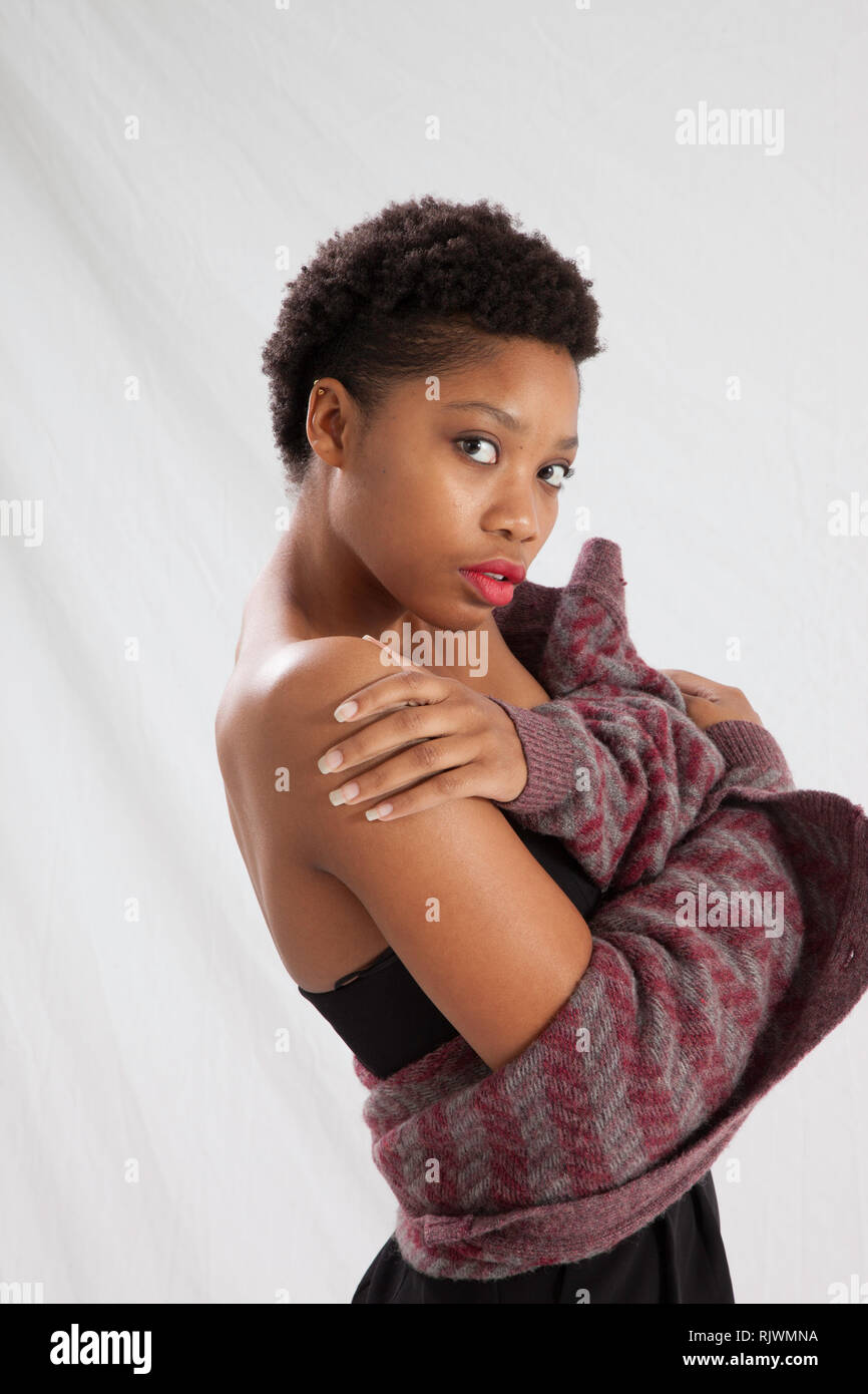 Lovely Black Woman with jacket off her shoulder Stock Photo - Alamy