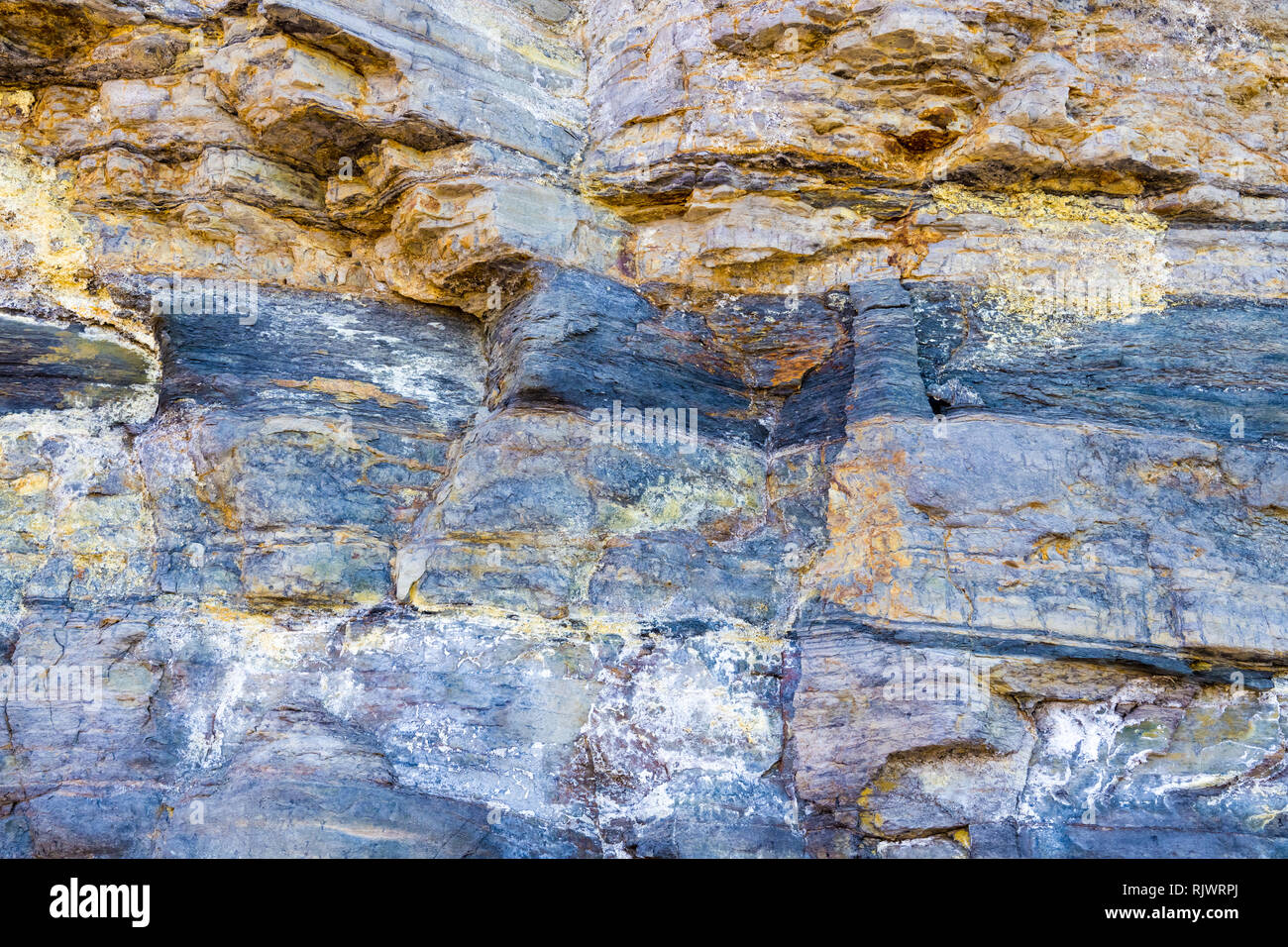 Colourful stone background texture, abstract formation of mineral rock ...