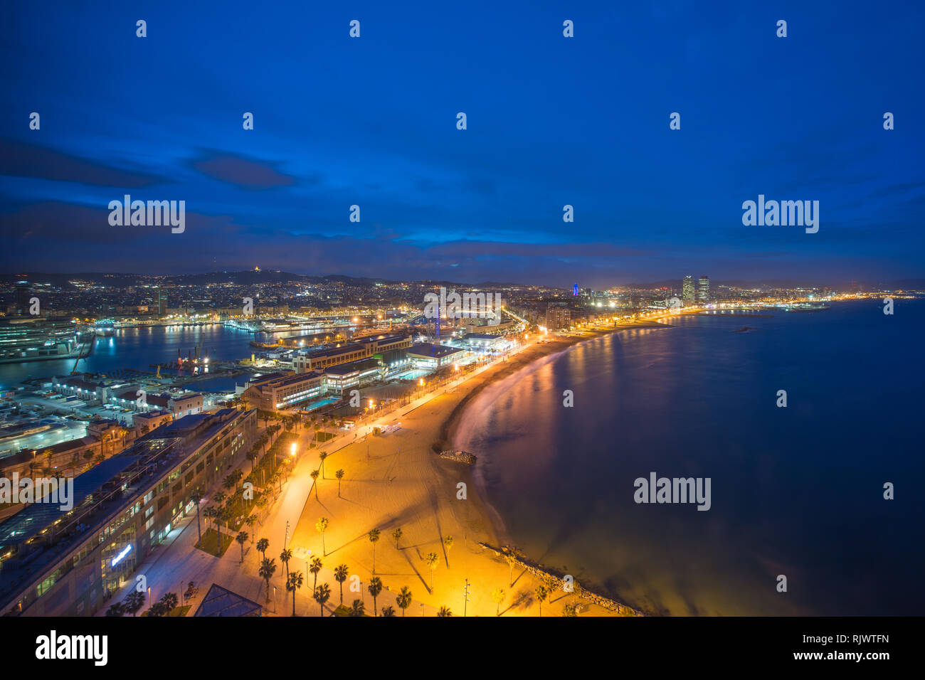 Aerial view of Barcelona Beach in summer night along seaside in ...