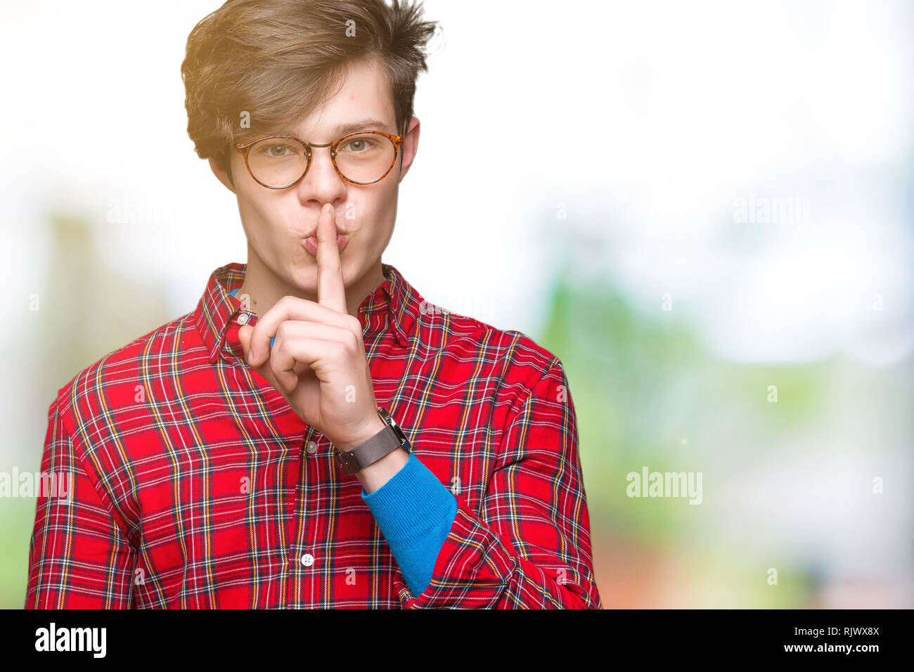 Teenager boy gesture shh hi-res stock photography and images - Alamy