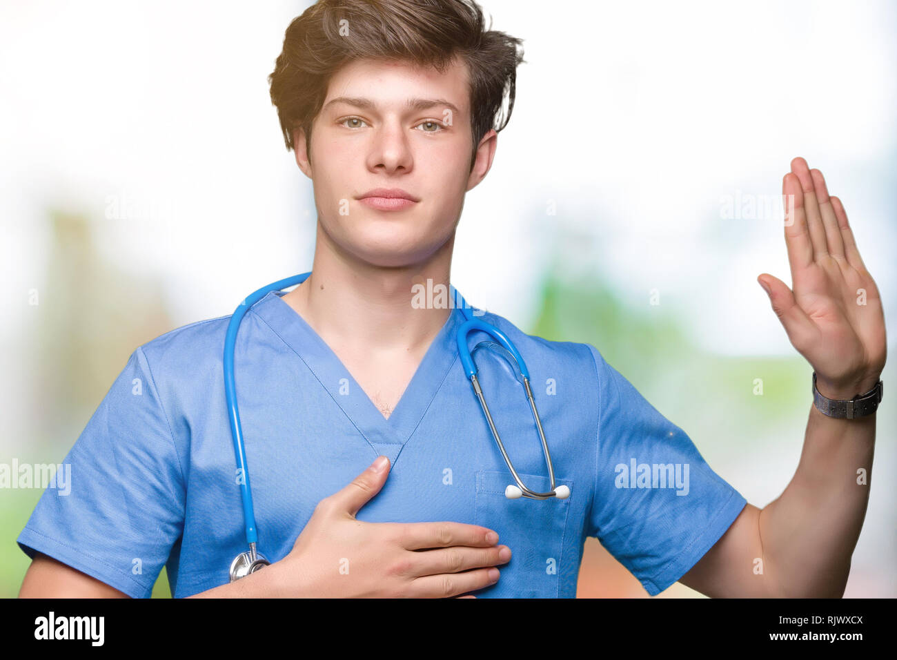 Young doctor wearing medical uniform over isolated background Swearing ...