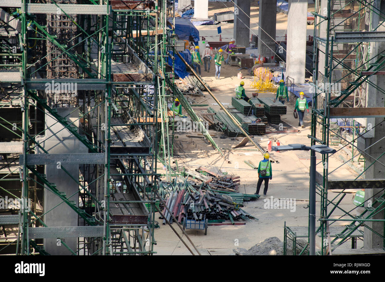 Asian people and thai workers with heavy machinery working builder new ...