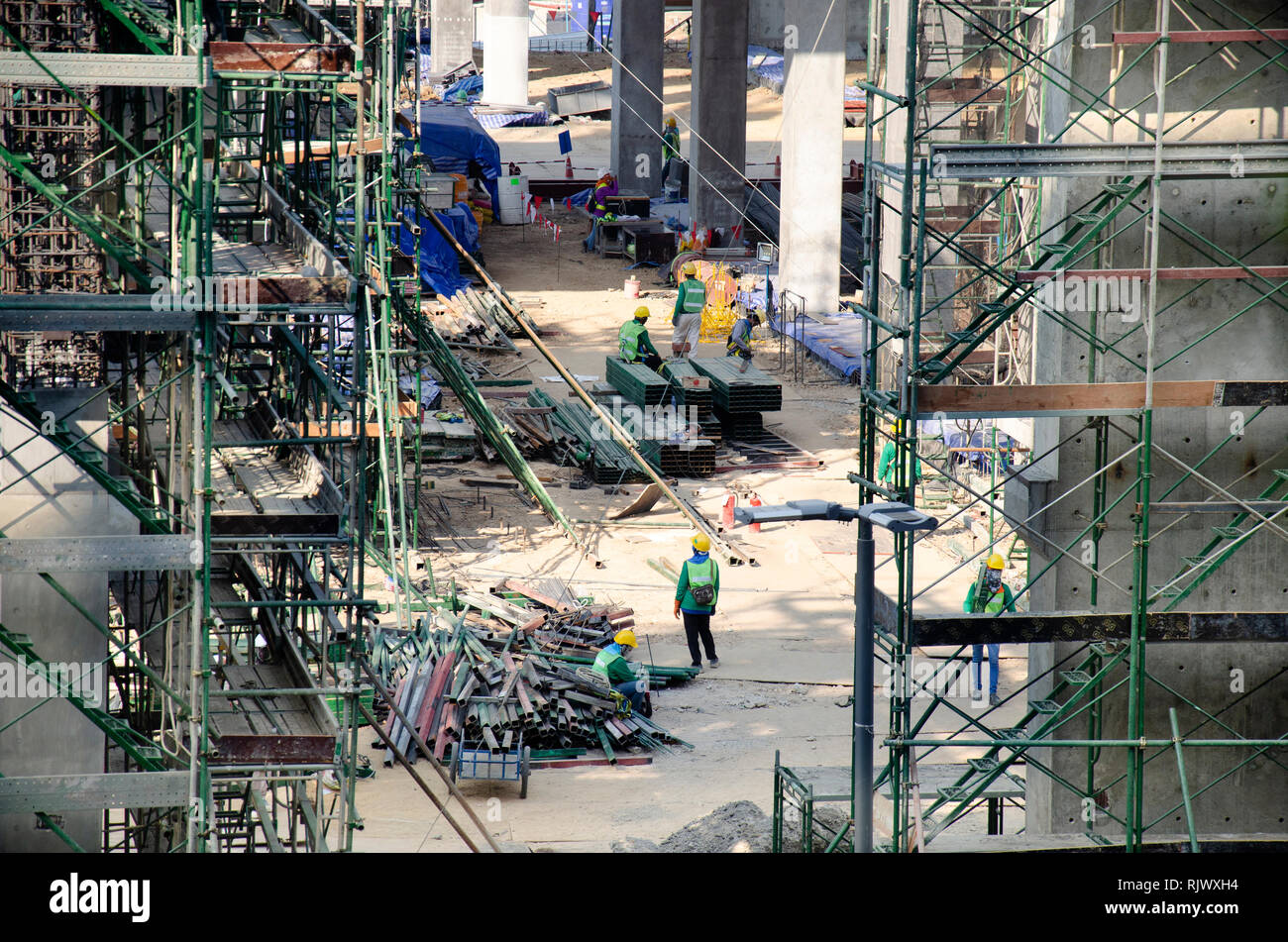 Asian people and thai workers with heavy machinery working builder new ...