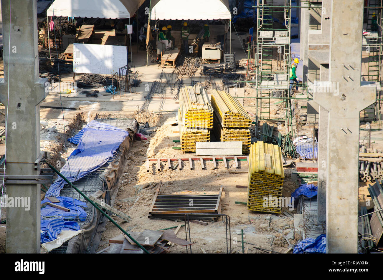 Asian people and thai workers with heavy machinery working builder new ...