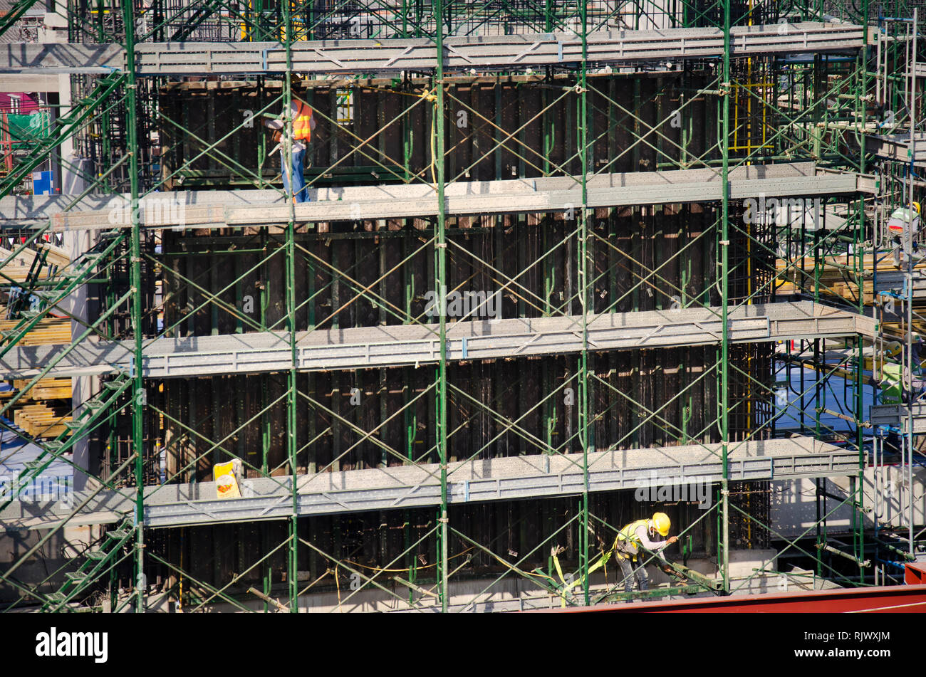 Asian people and thai workers with heavy machinery working builder new ...