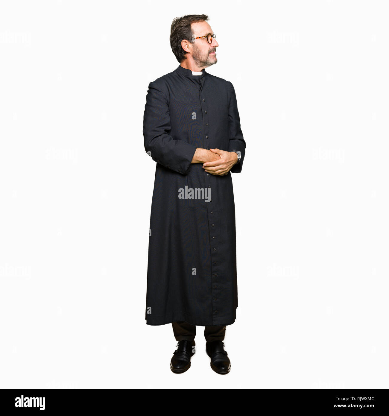 Side view mature catholic priest hi-res stock photography and images ...