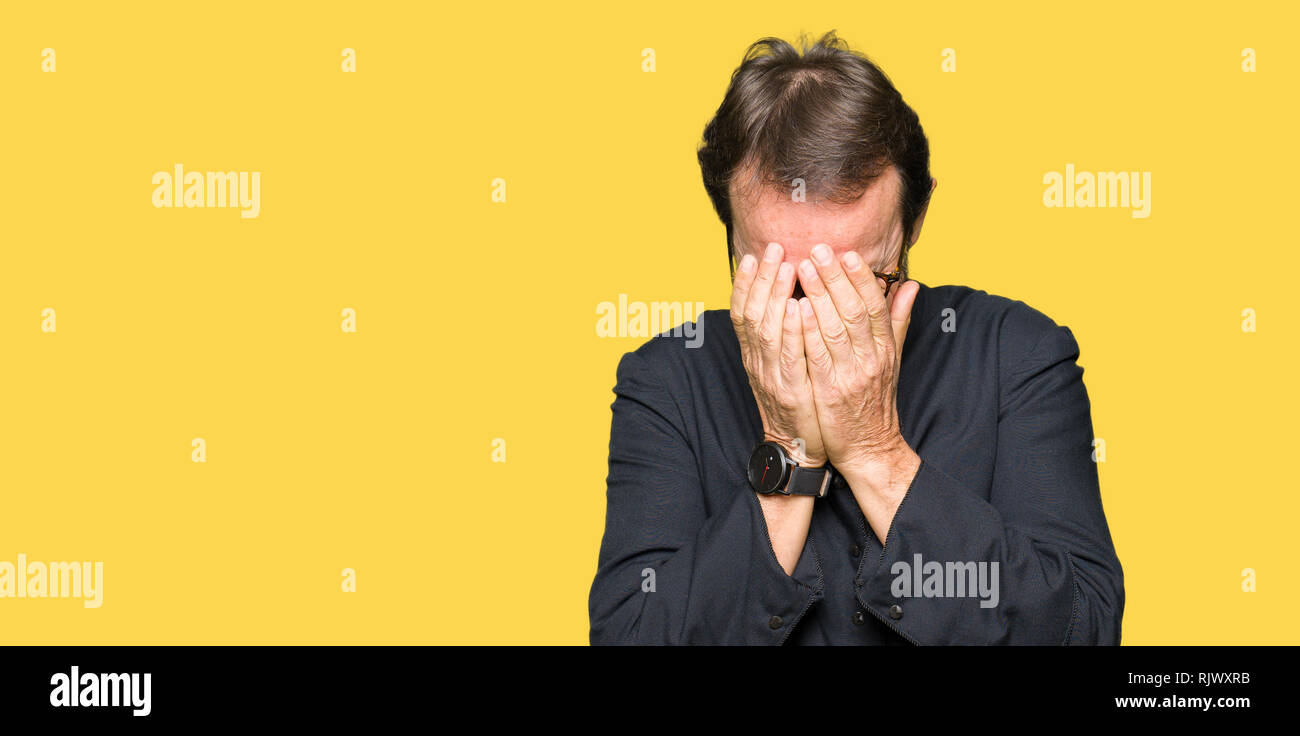 Middle age priest man wearing catholic robe with sad expression ...