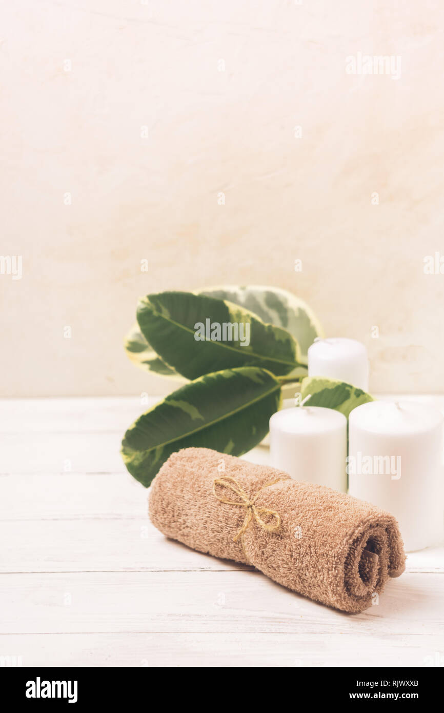 A clean soft towel tied with a natural rope for spa treatments ...