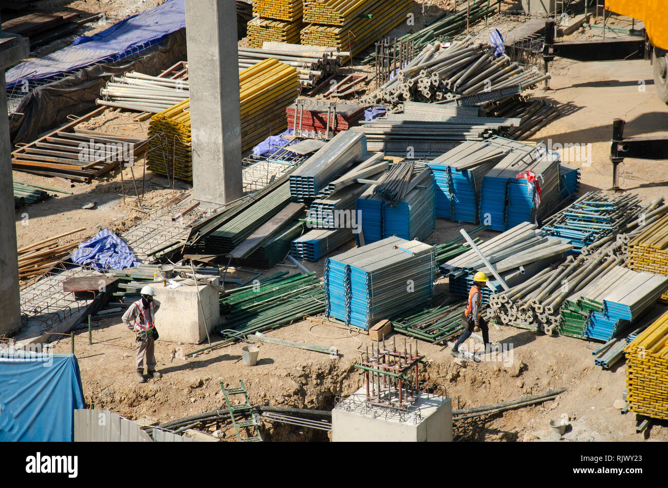 Asian people and thai workers with heavy machinery working builder new ...