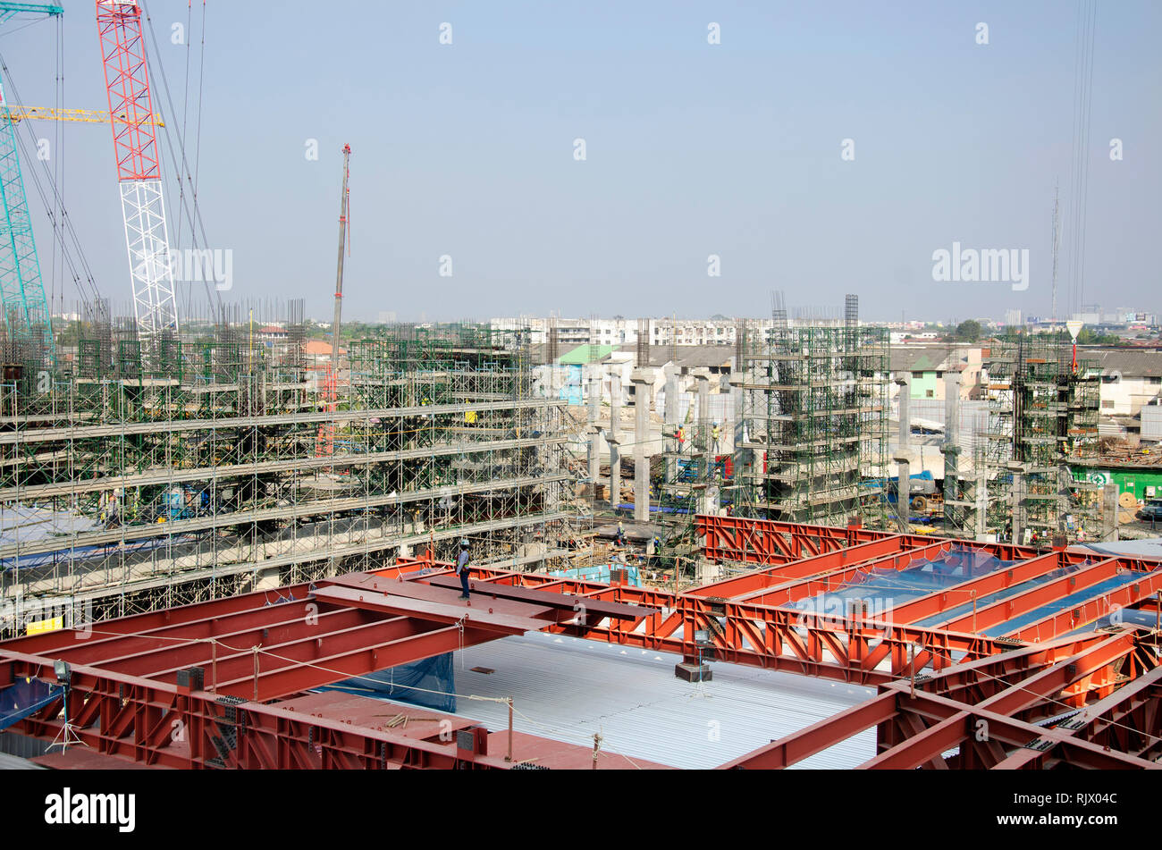 Asian people and thai workers with heavy machinery working builder new ...