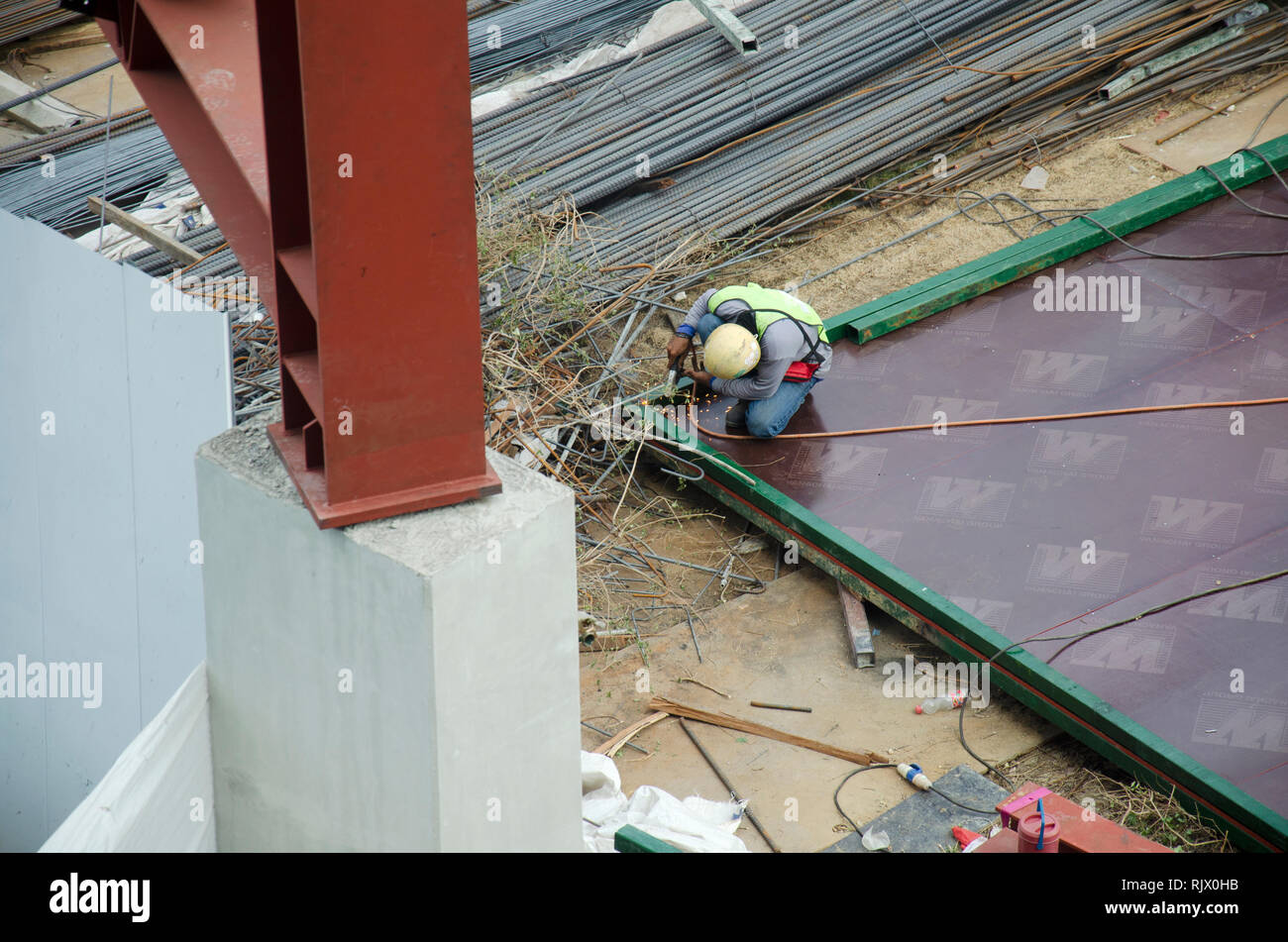 Asian thai people worker welding steel in construction site making ...