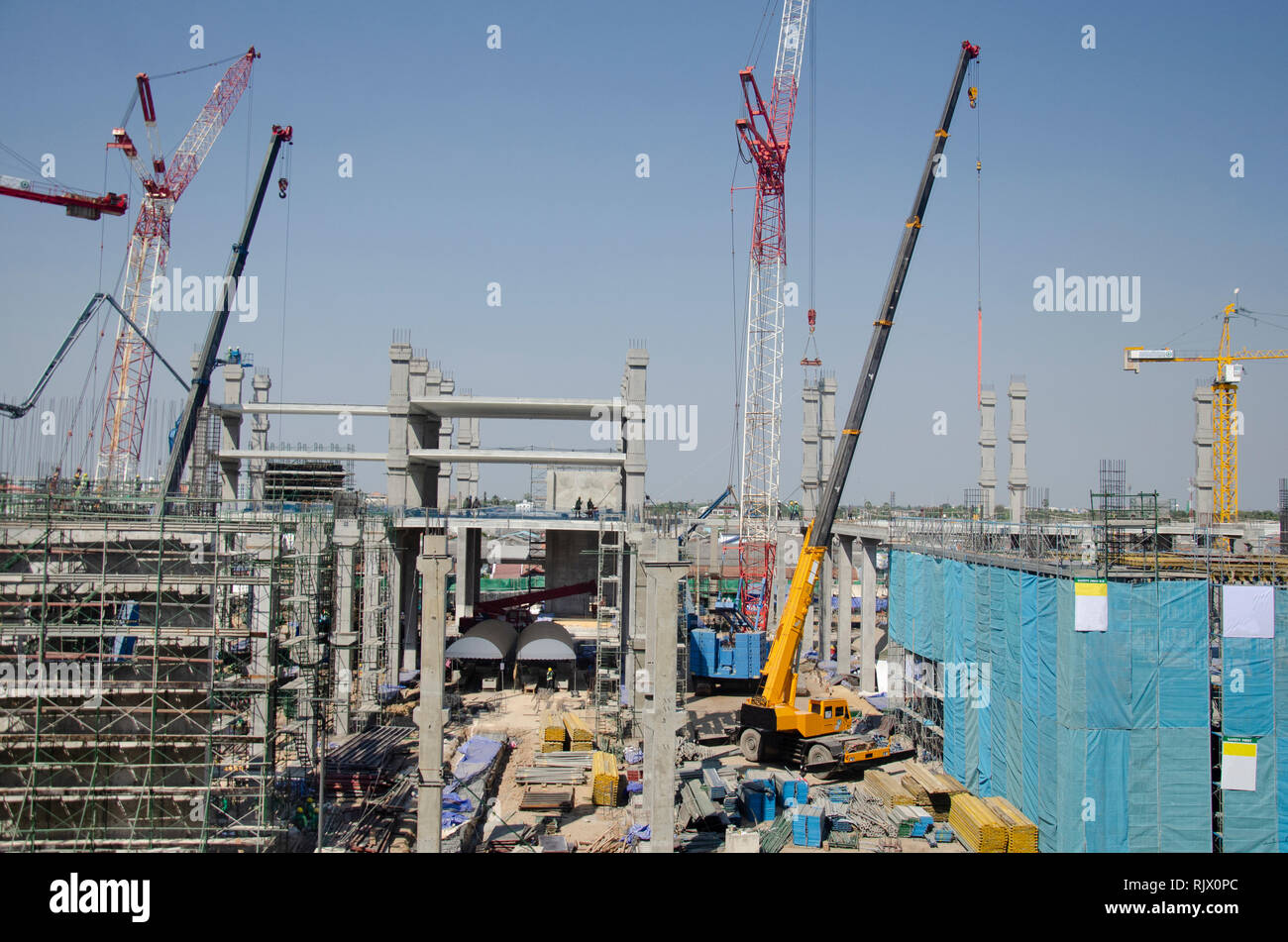 Asian people and thai workers with heavy machinery working builder new ...